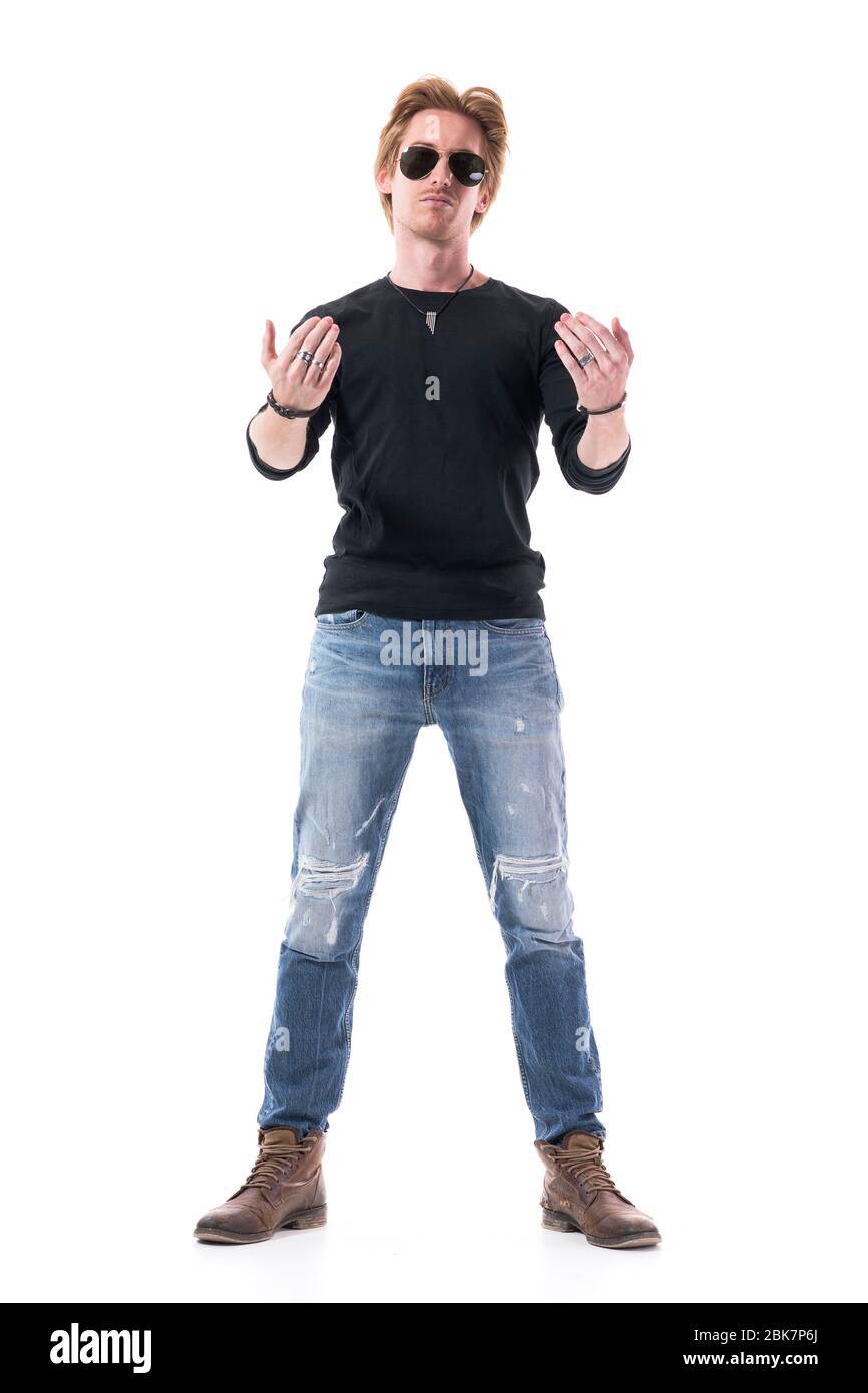 Cocky young handsome man with daring attitude provoking and beckoning ...