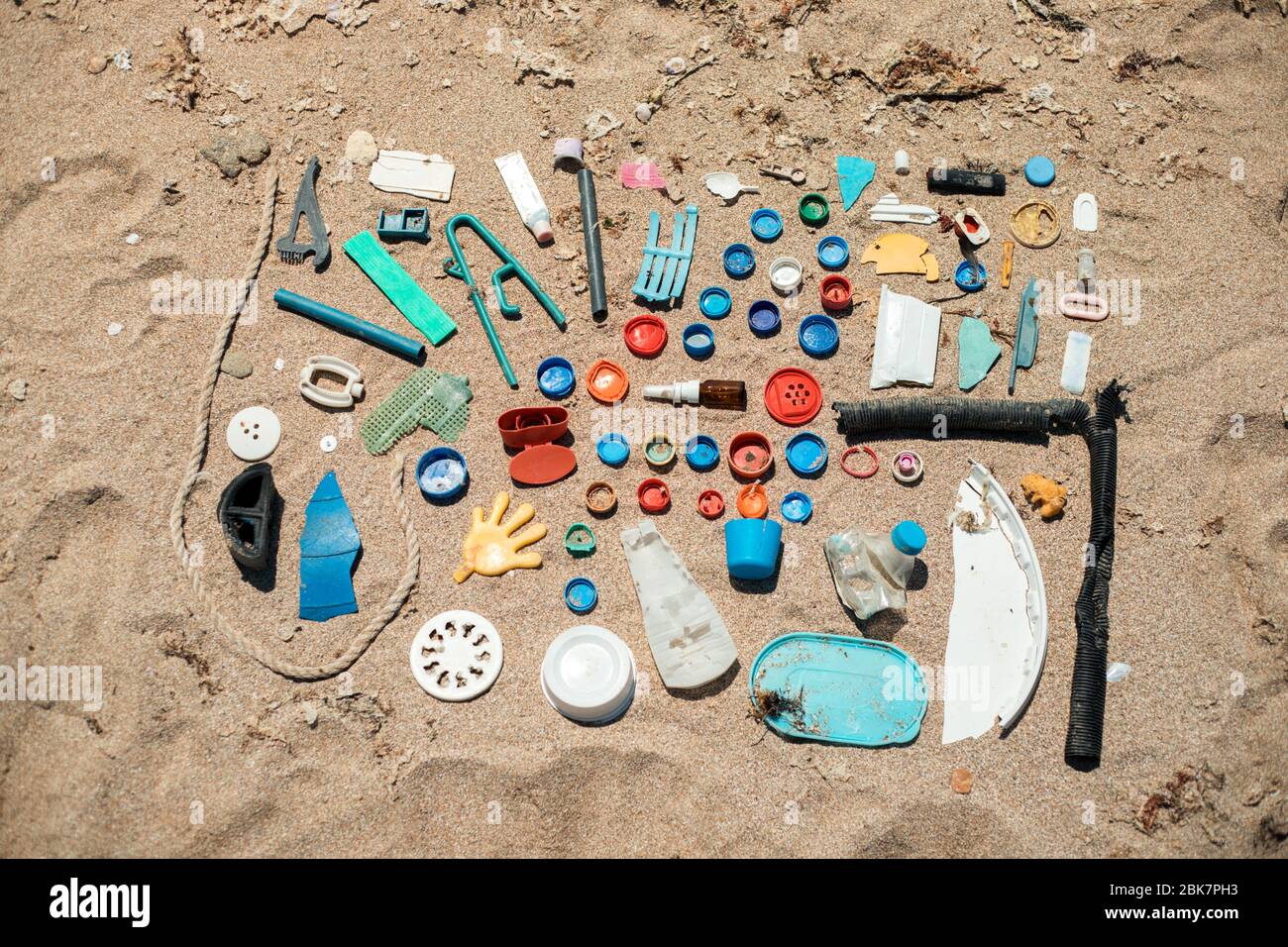 Close up plastic waste on ocean beach. Concept of the problem of ...
