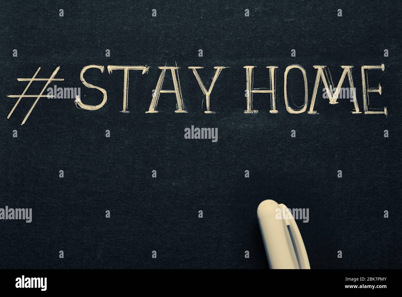 Stay at home, text. Headline inscription on black paper background ...