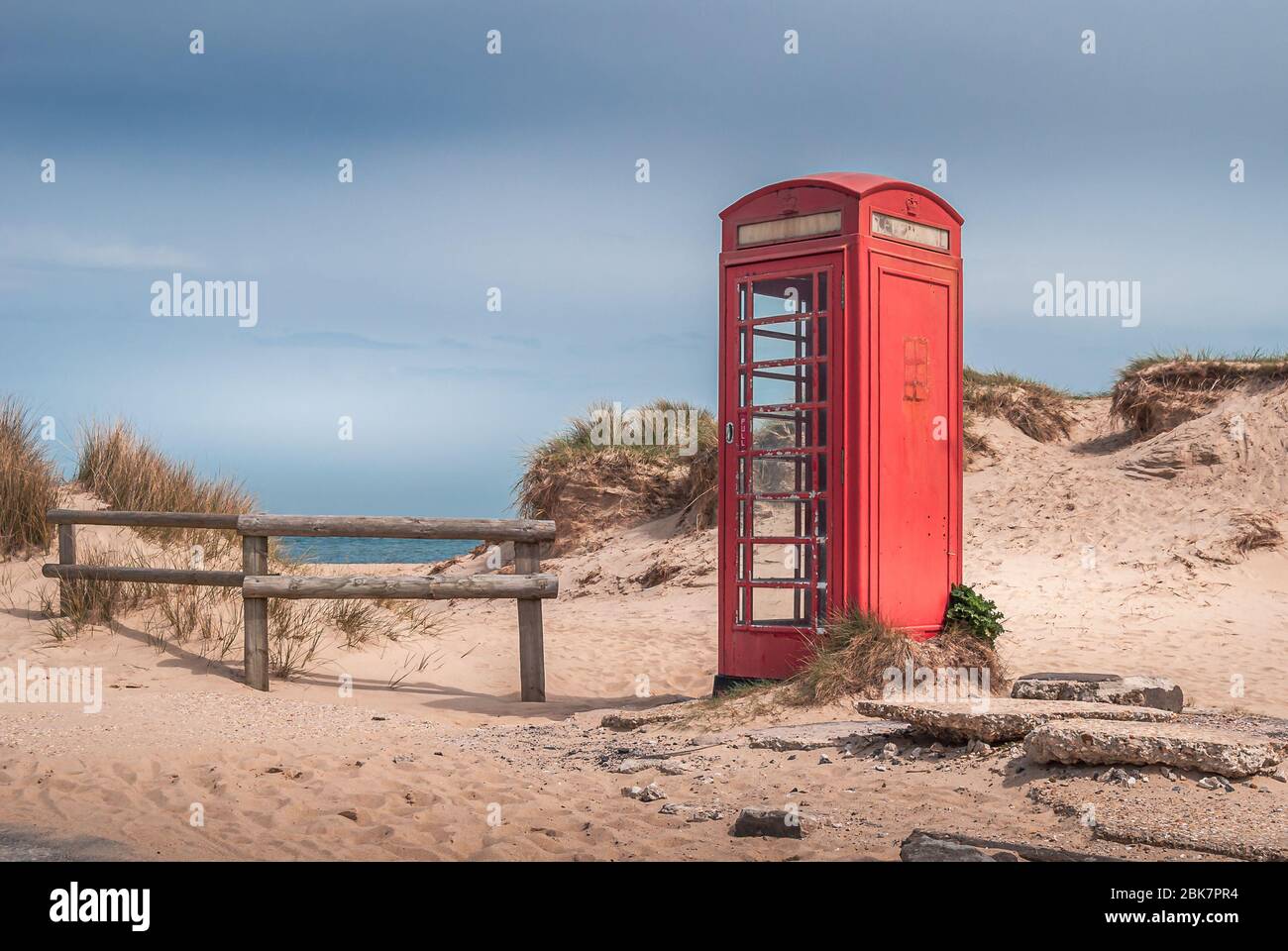 The iconic and weathered red telephone box on Shell Bay beach, Studland ...