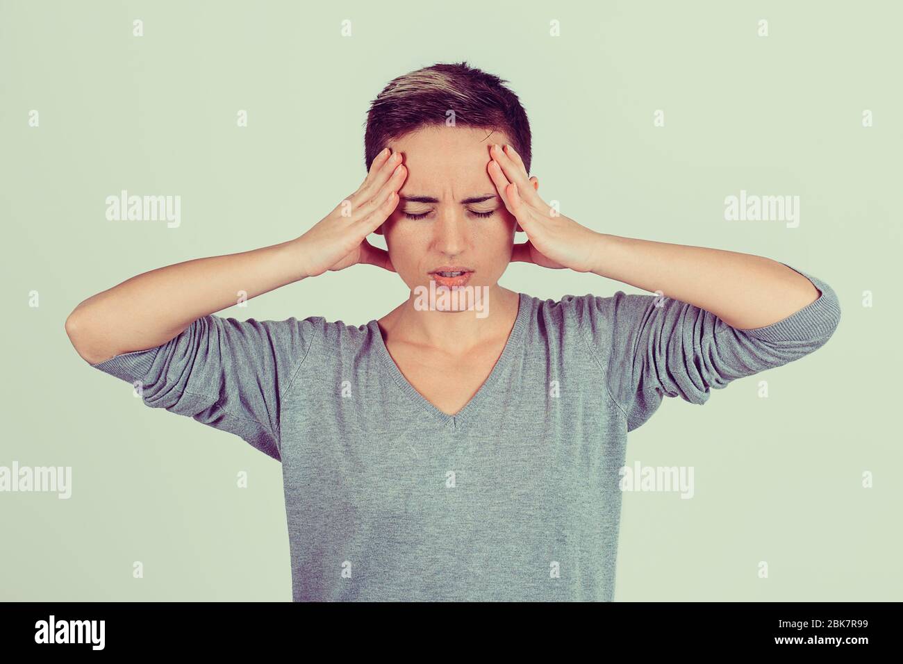 Closeup sad woman with worried stressed face expression isolated on ...