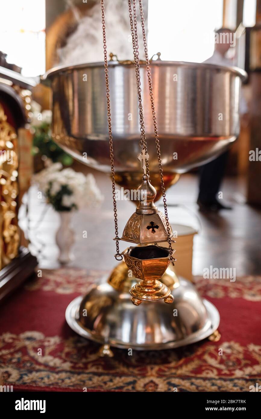 selective focus. A priest's censer hangs on an old wall in the Orthodox ...