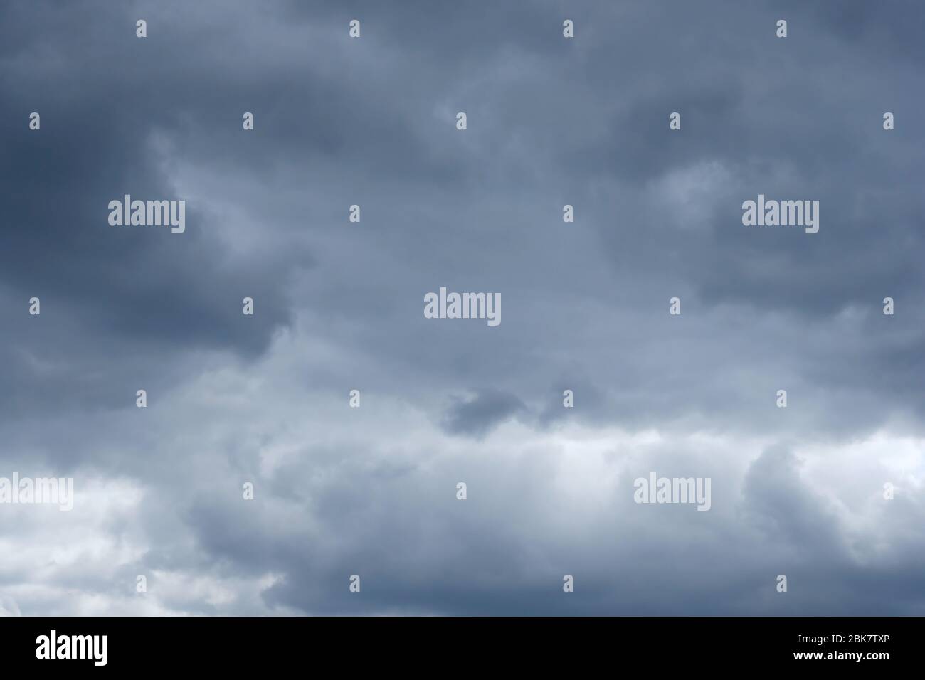 Gray cloudy sky. Clouds overcast sky background. Abstract background time before rain with ...