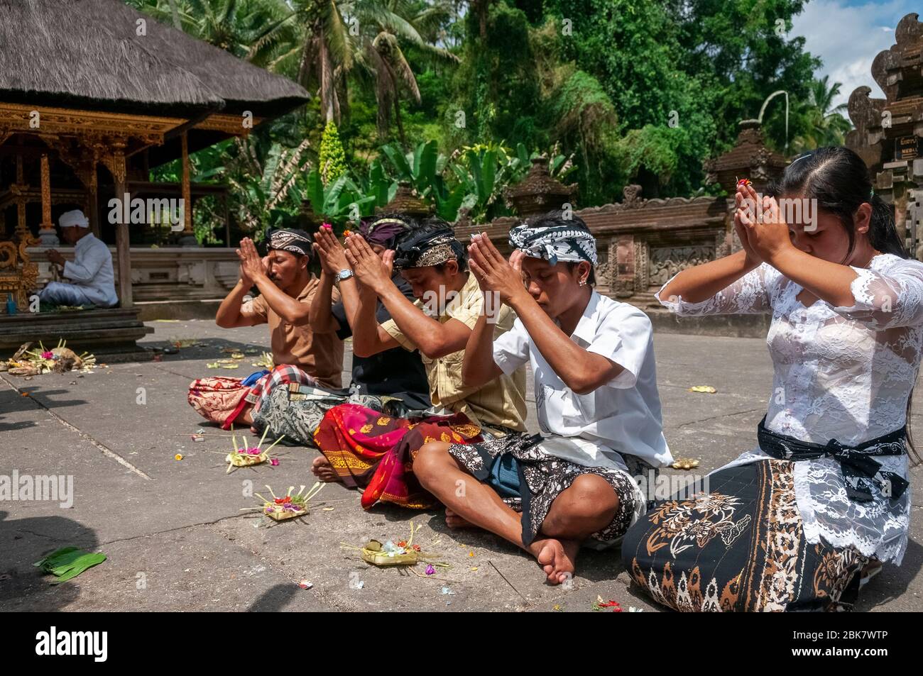 Seated worshipers at Tirta Empul Holy Springs Bali Indonesia Stock ...