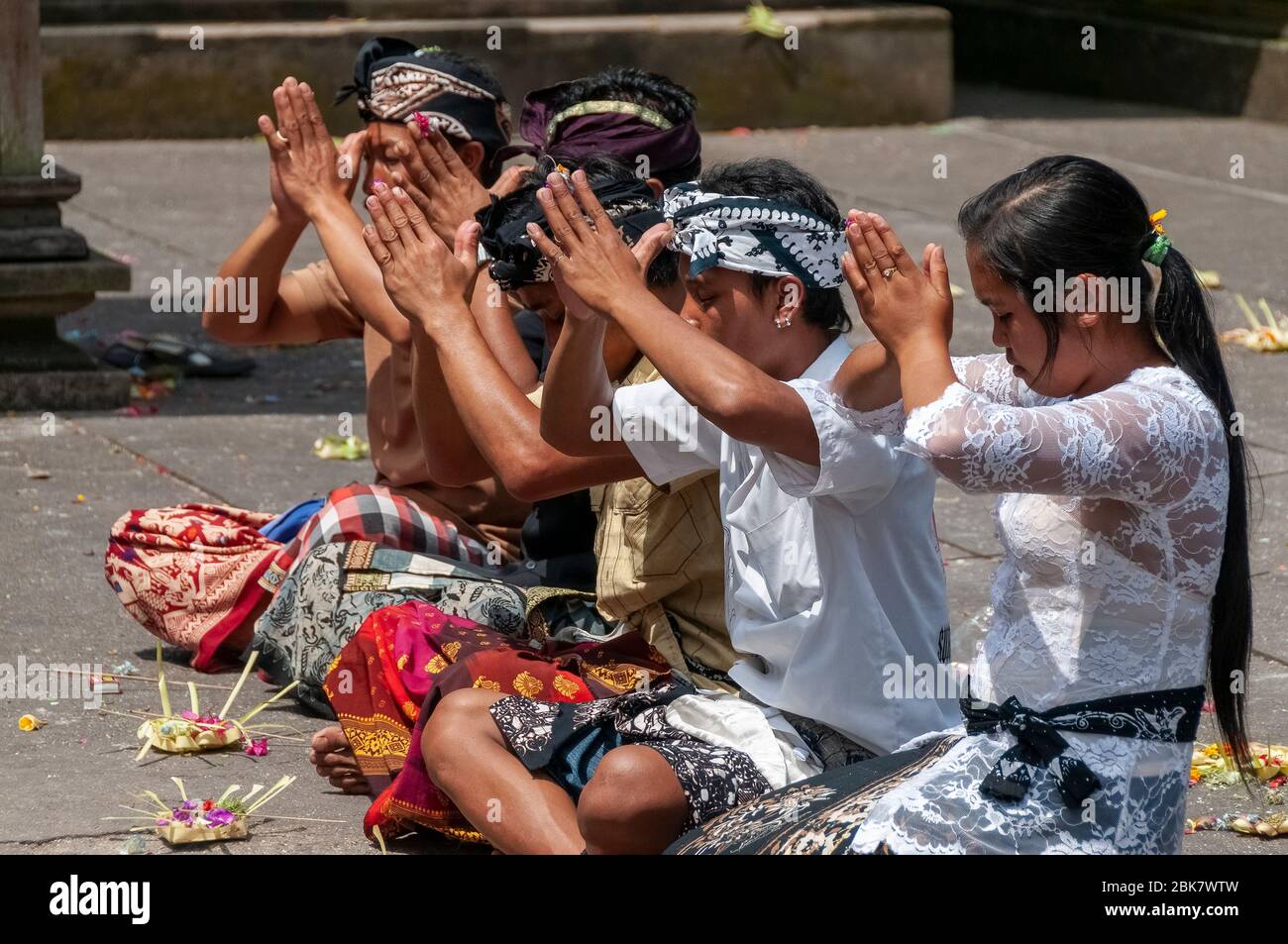 Seated worshipers at Tirta Empul Holy Springs Bali Indonesia Stock ...