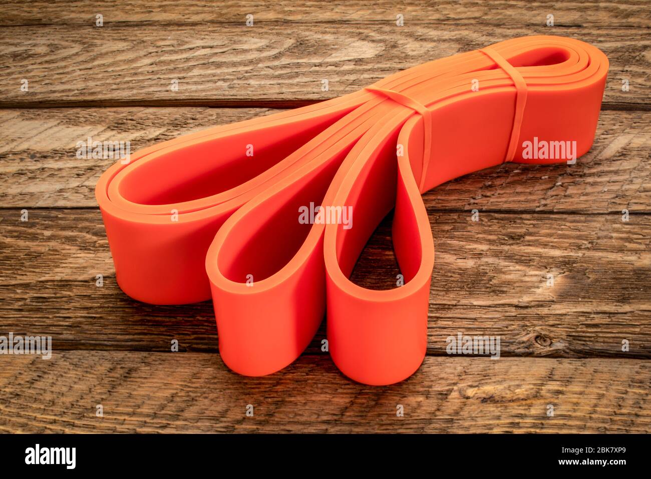 resistance exercise band for fitness and rehabilitation against wooden ...