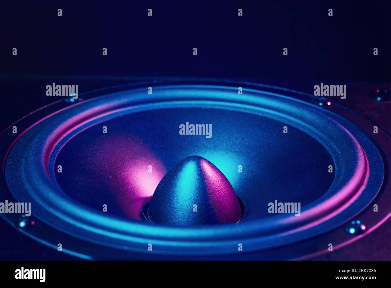 Sound audio speaker with neon lights on dark background. Dynamic ...