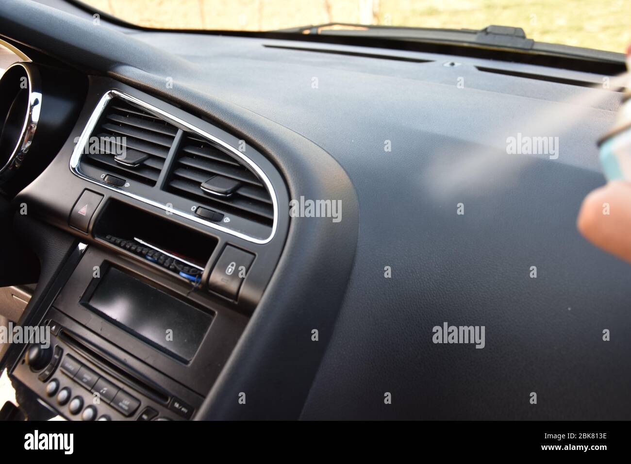 Cleaning Car Interior And Spraying With Liquid Stock Photo - Alamy