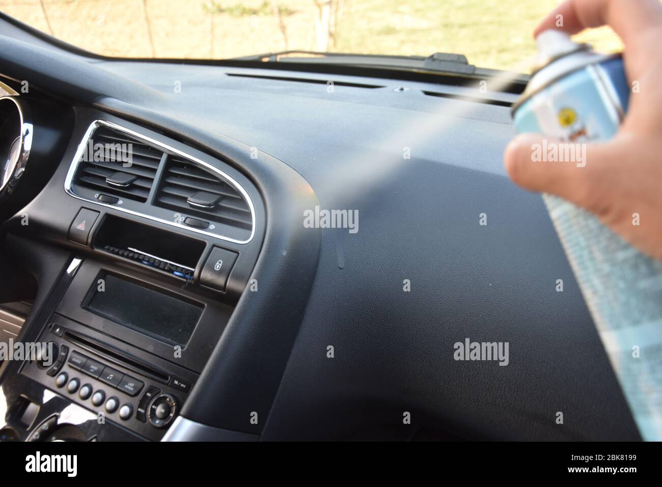 Cleaning Car Interior And Spraying With Liquid Stock Photo - Alamy