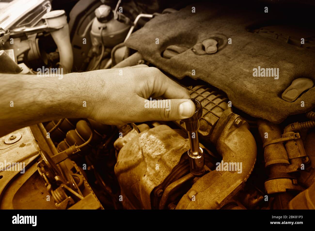 Mechanic checking and fixing a broken car in car service Stock Photo ...