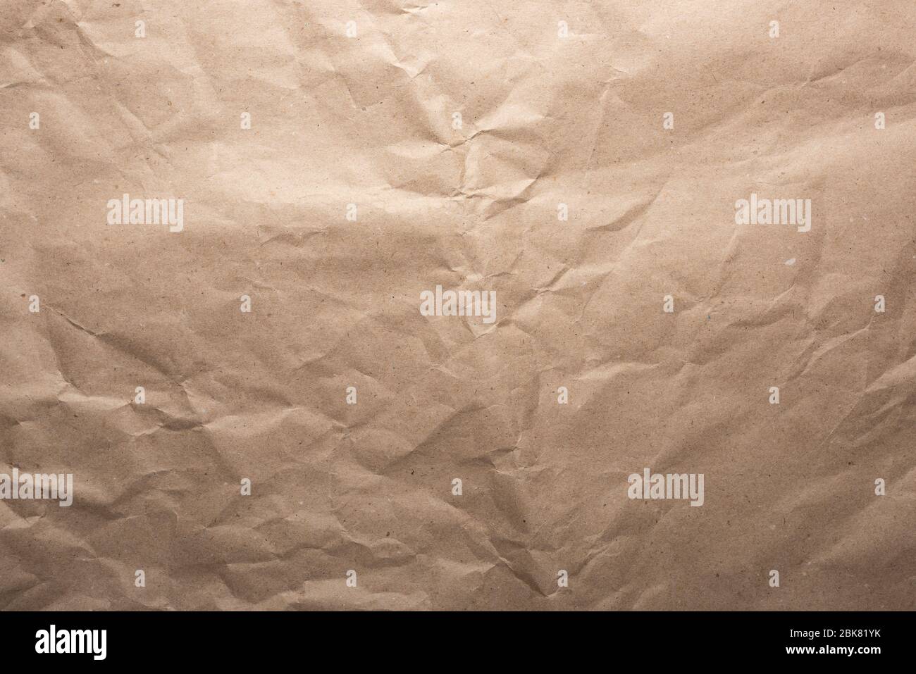 crumpled craft paper background with light gradient Stock Photo - Alamy