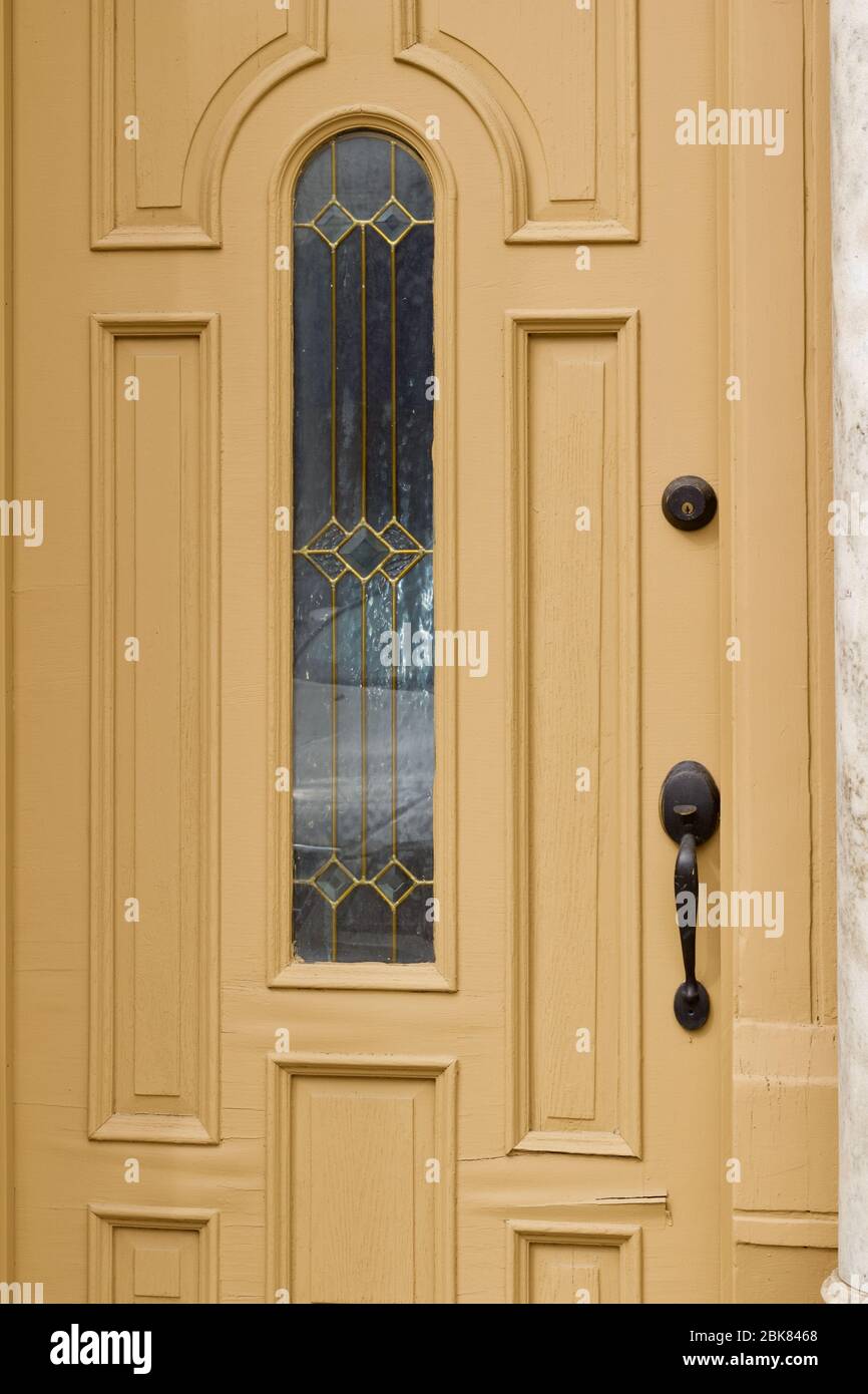 Abstract view of a beautiful golden yellow color wooden door with ...