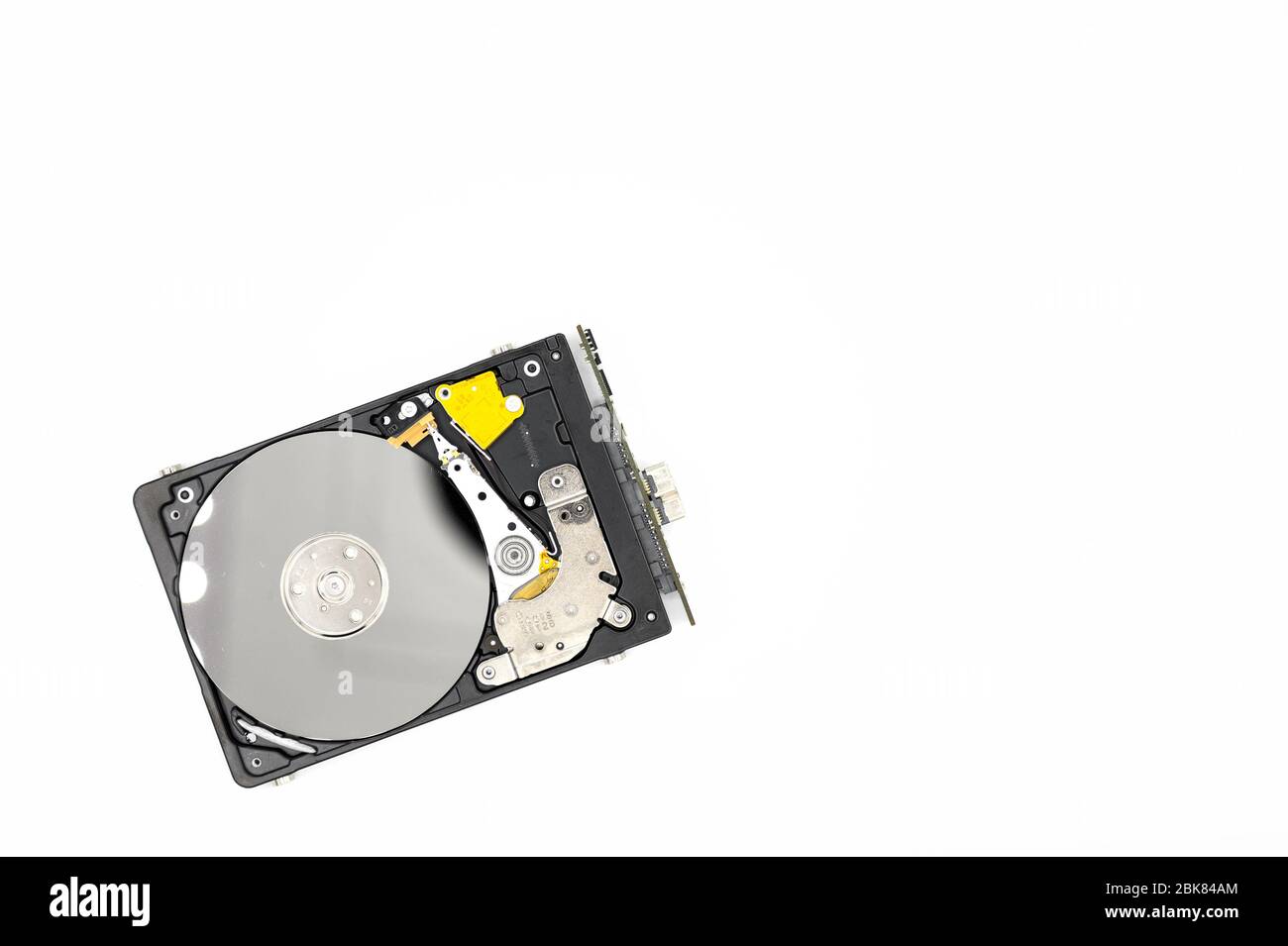 Disassambled Hard disk drive isolated on white background reflection ...