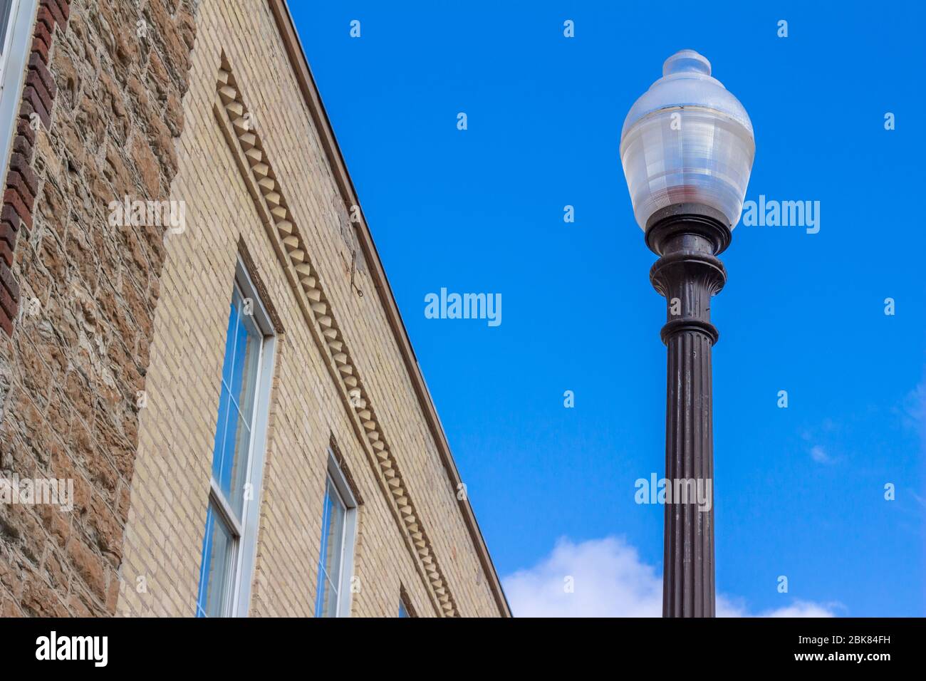 Close upward view of an attractive city street light pole, next to a ...