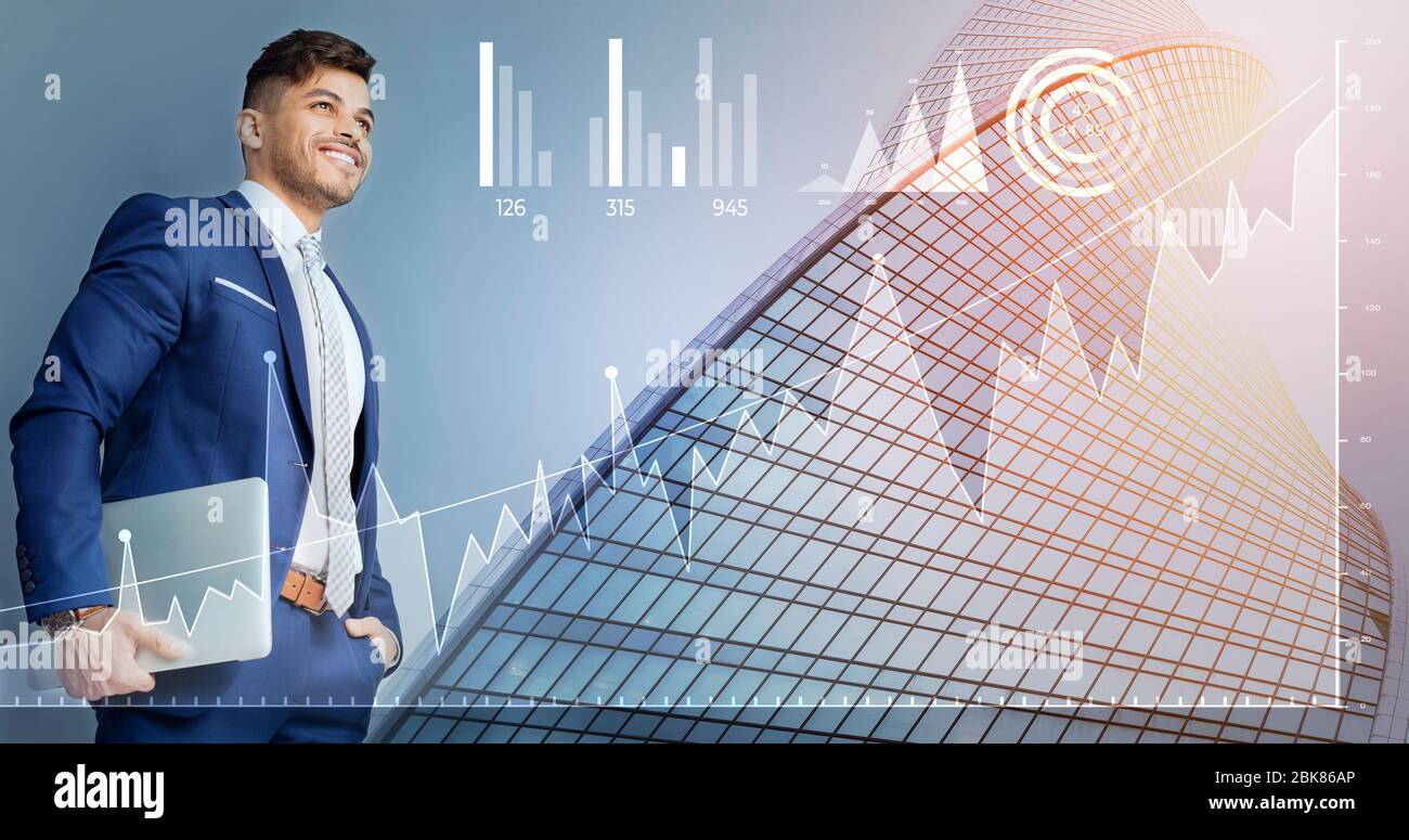 Successful businessman with laptop looking at trading schemes Stock ...