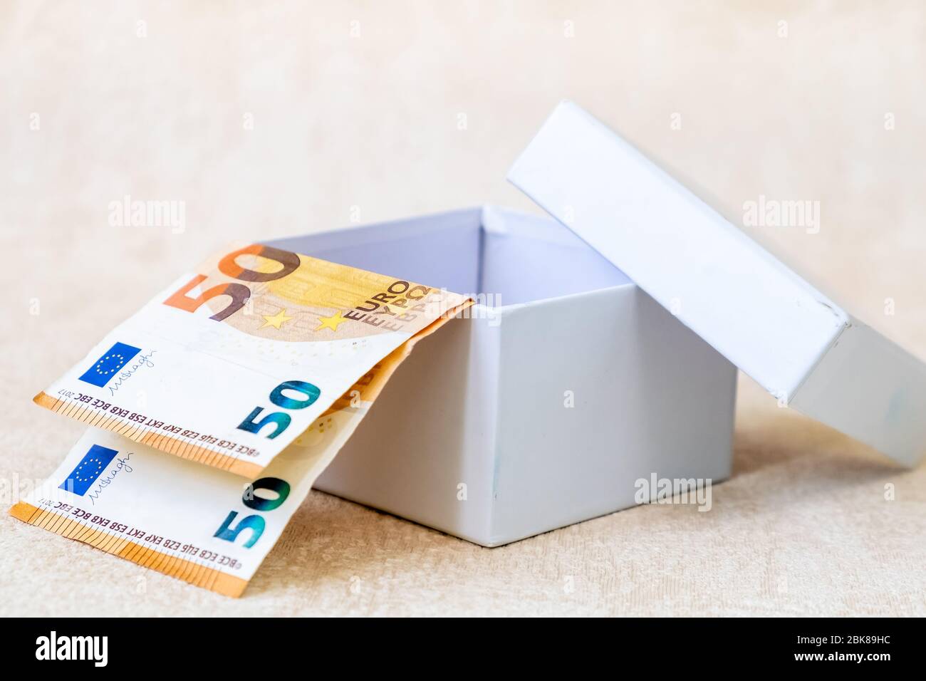 Two European Banknotes of 50 Euro in white gift box. Studio Shot Stock ...