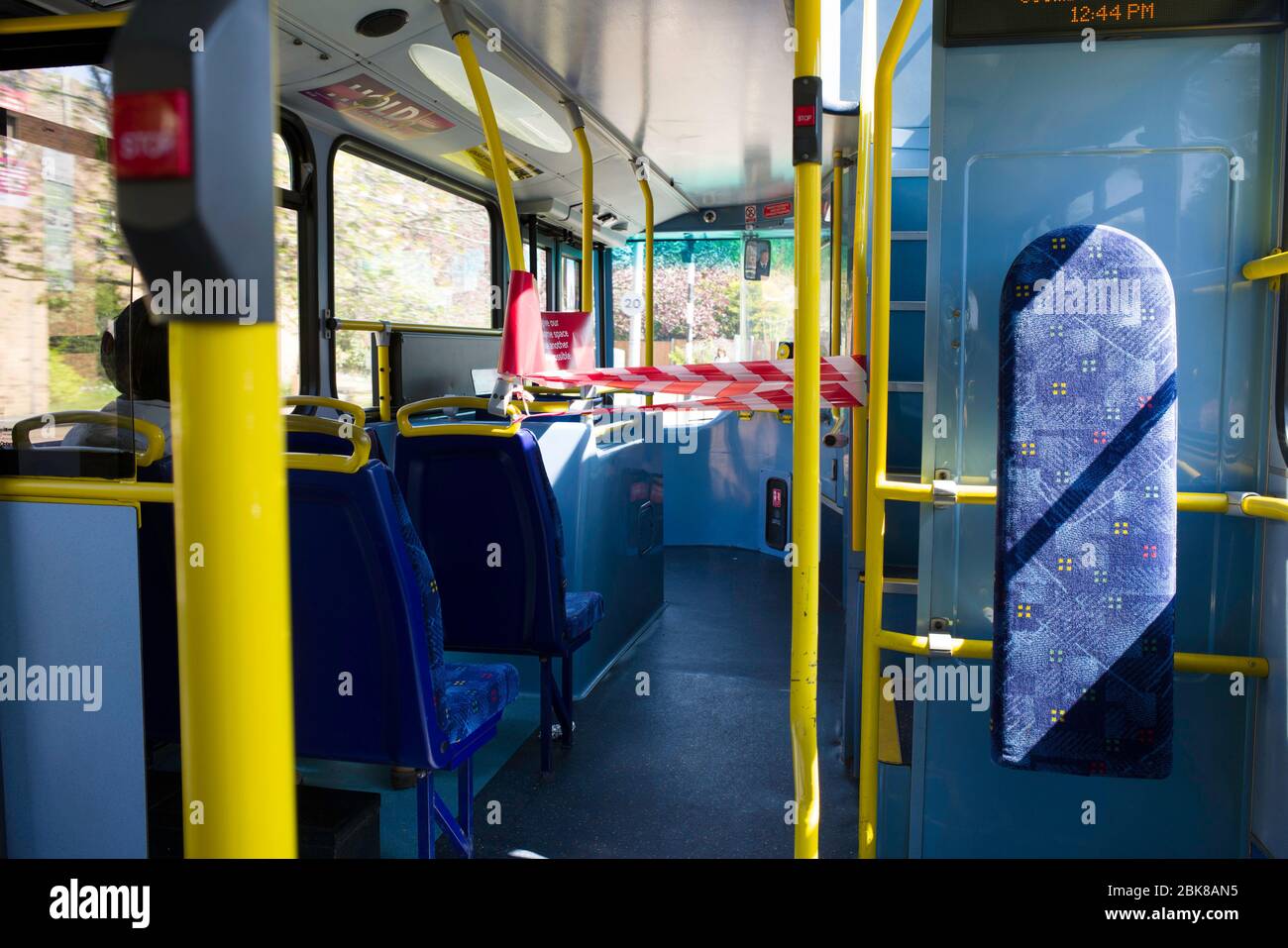Taped off area on buses preventing passengers from sitting next to bus ...