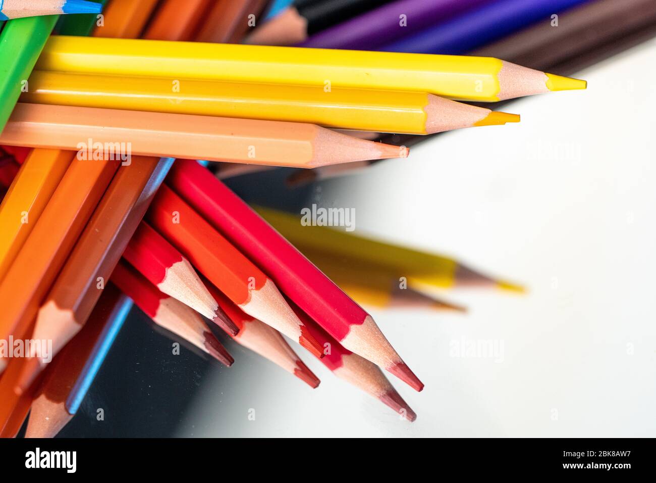 Many different colored pencils on white background Stock Photo - Alamy