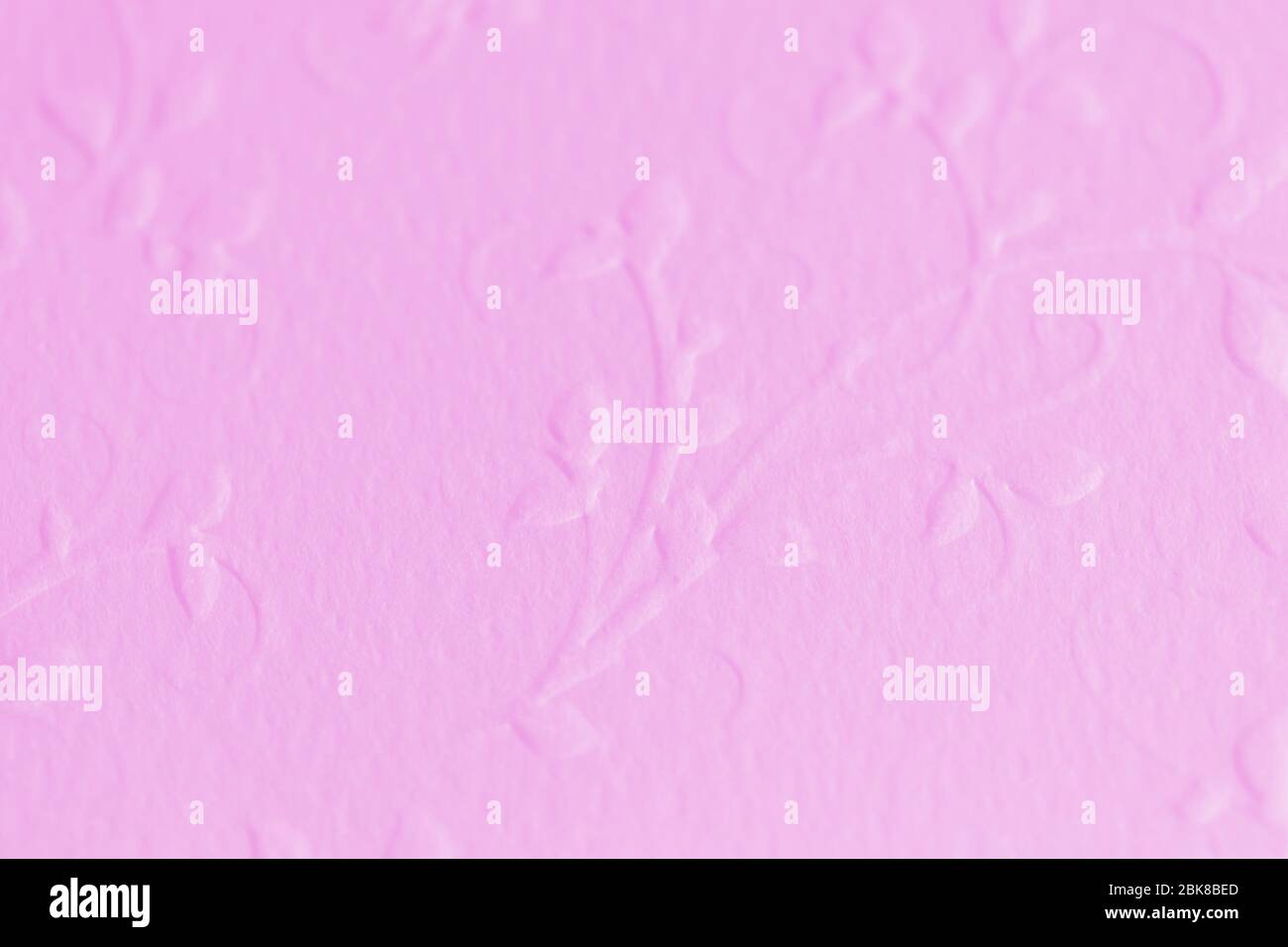 Light pink paper with embossed flowers pattern Stock Photo - Alamy
