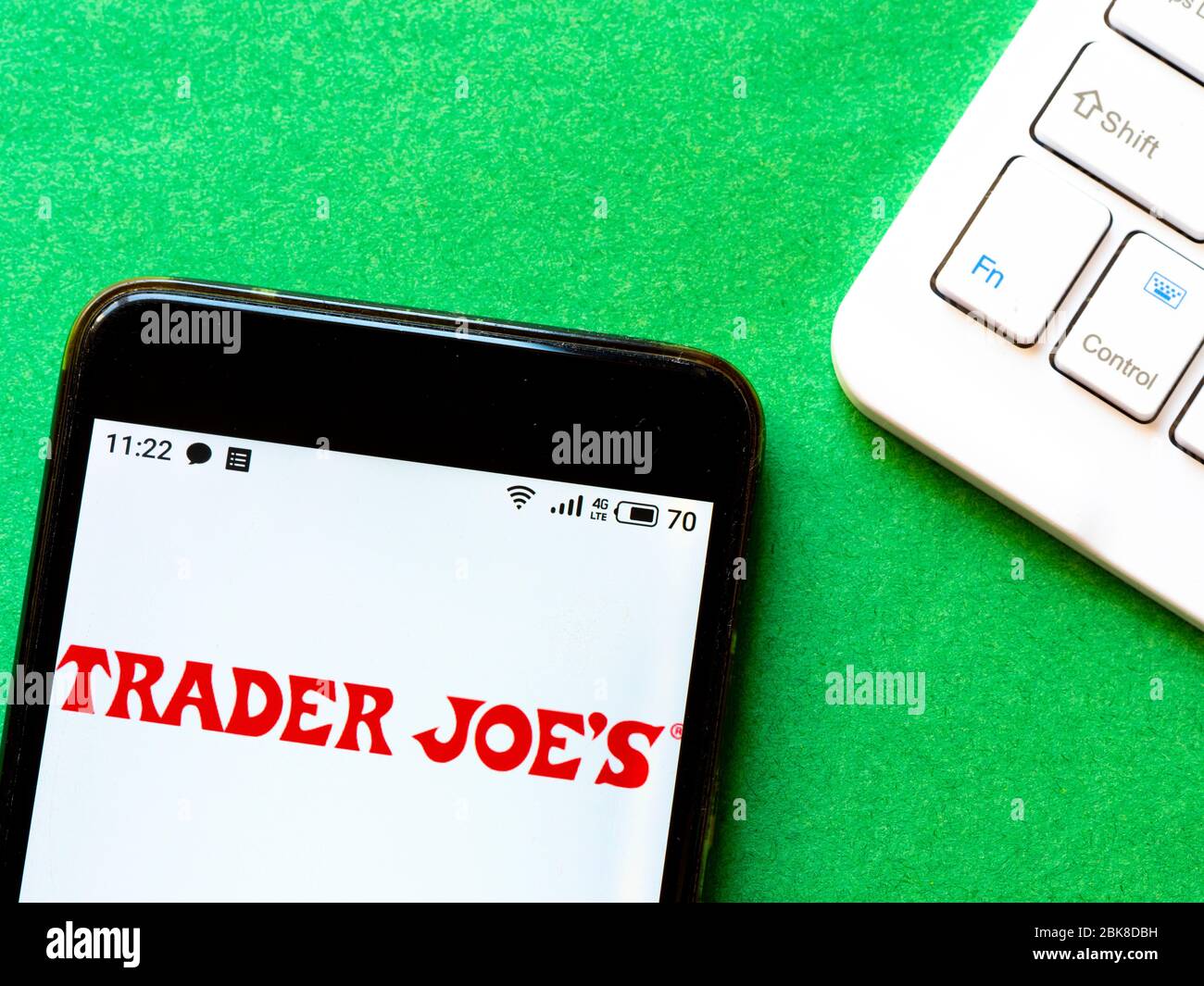 In this photo illustration Trader Joe’s logo seen displayed on a ...