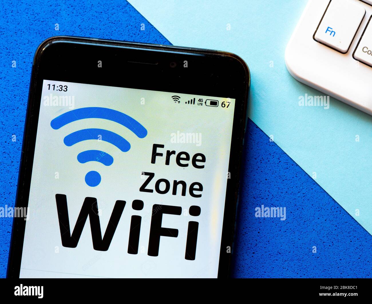 In this photo illustration a Free zone WiFi logo seen displayed on a ...