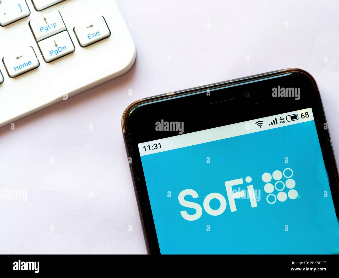 In this photo illustration a SoFi logo seen displayed on a smartphone ...