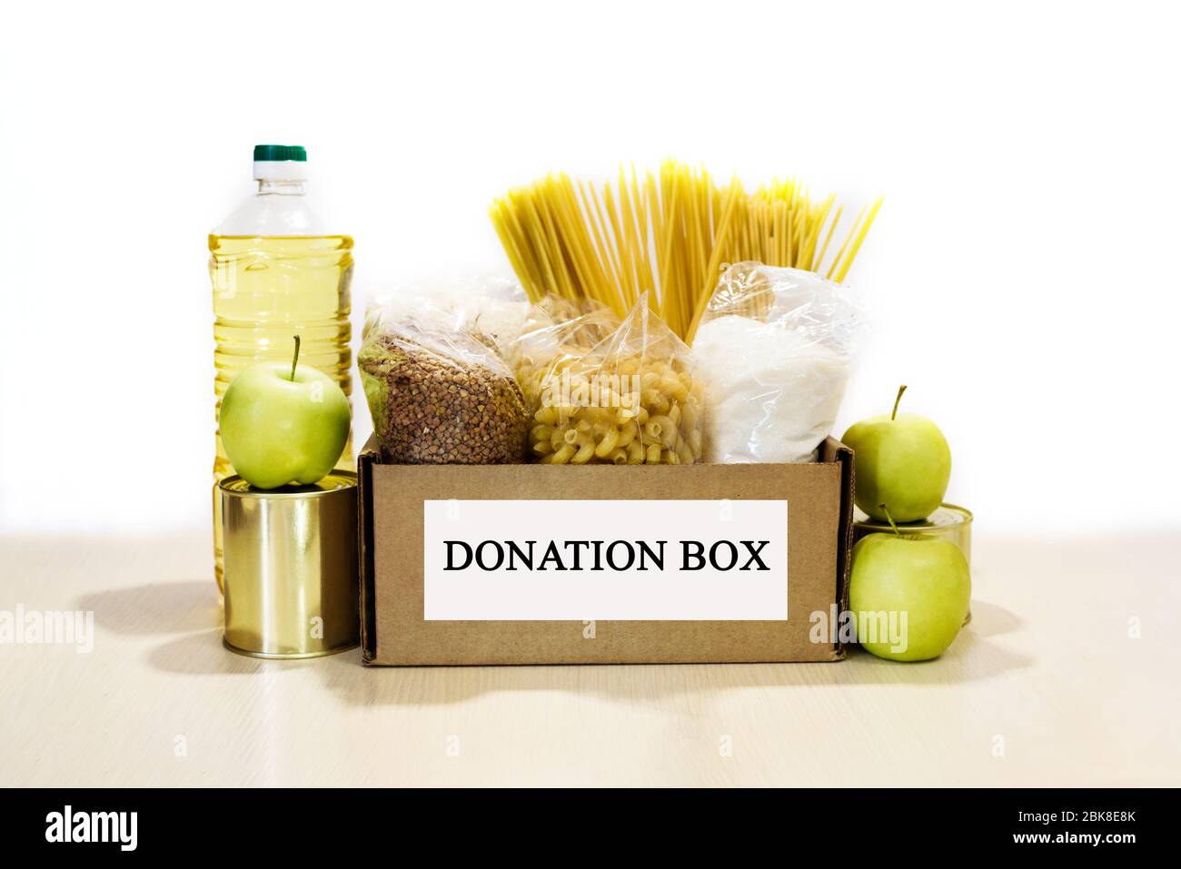 Full donation food box with many products on the white background ...
