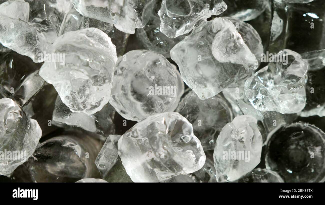Top view of ice rotation on black background. Close up Stock Photo - Alamy