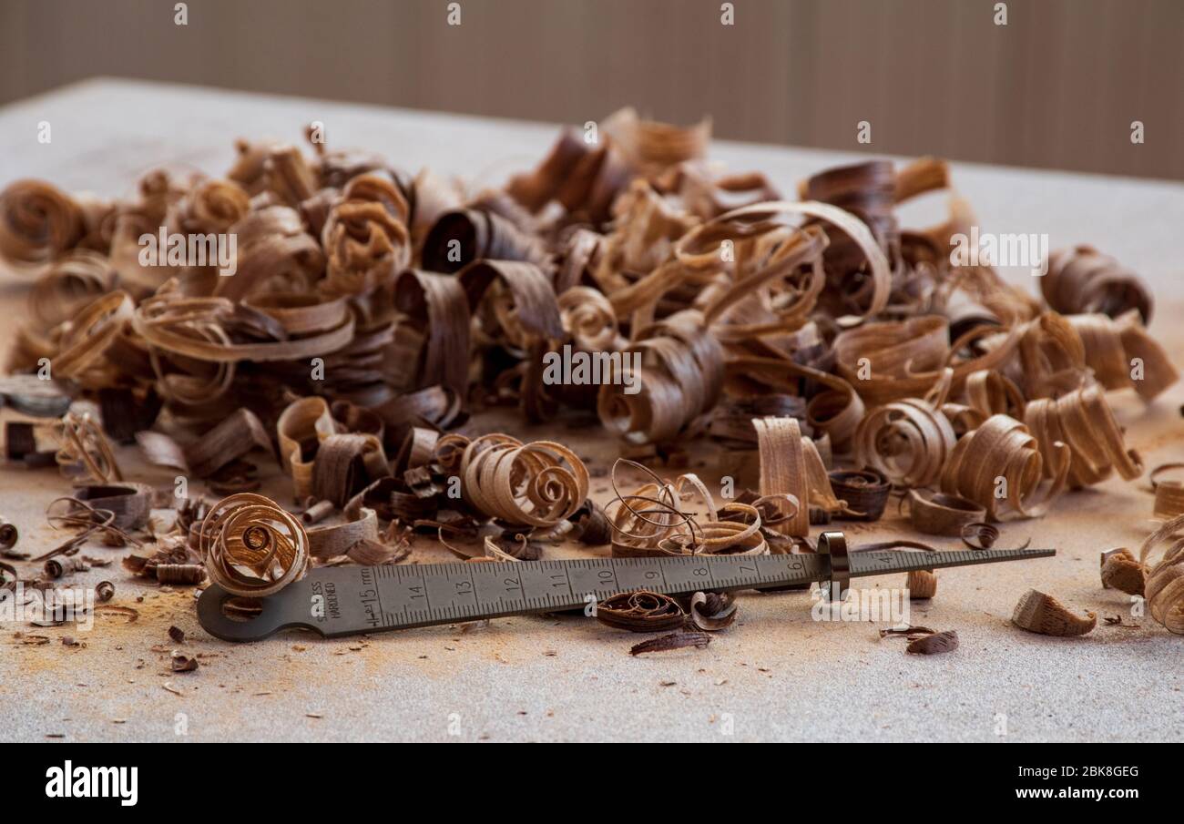 tapering ruler for inner diameter in wood chips on the workbench Stock ...