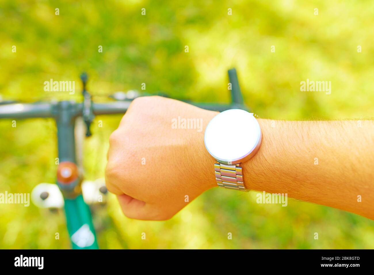Man conducts Cycling training with a smart watch on the offroad at ...