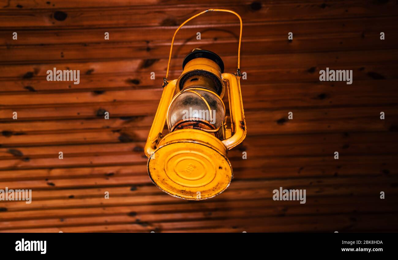 very old, used vintage metal gas light still active, as an ancient ...