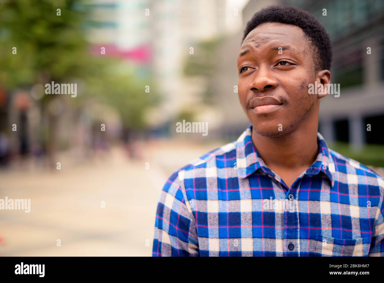 Young handsome African man exploring the city Stock Photo - Alamy