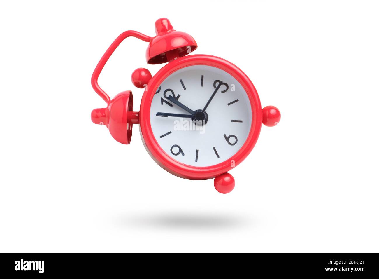 Red analog clock on a white background. Isolated. Close up Stock Photo ...
