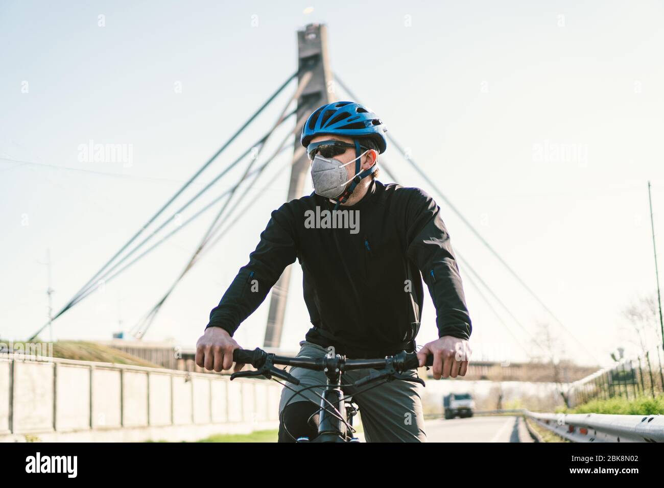 Male cyclist wearing respirator face mask with heavy duty protective ...