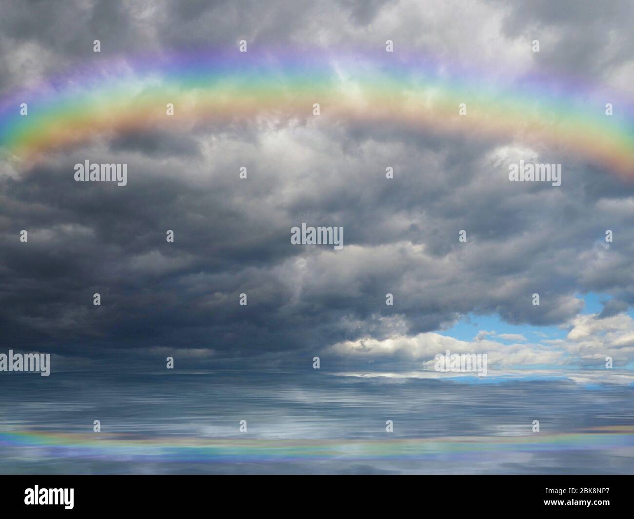 Natural background with rainbow in sea reflection Stock Photo - Alamy
