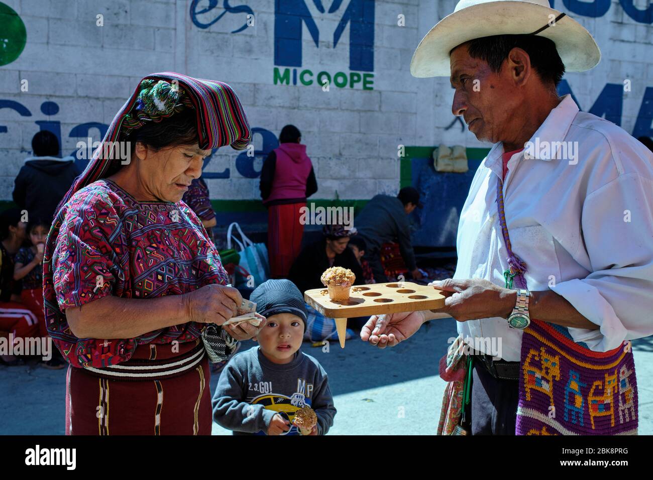 Lady dressed in the colorful typical costume of the Ixil community ...