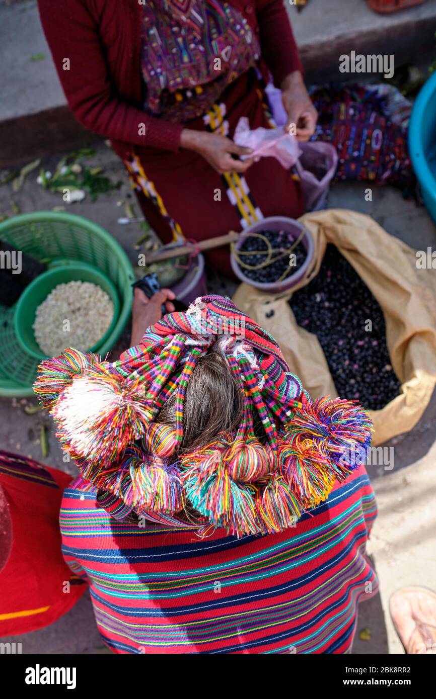 View from above of a woman dressed in the typical costume of the Ixil ...