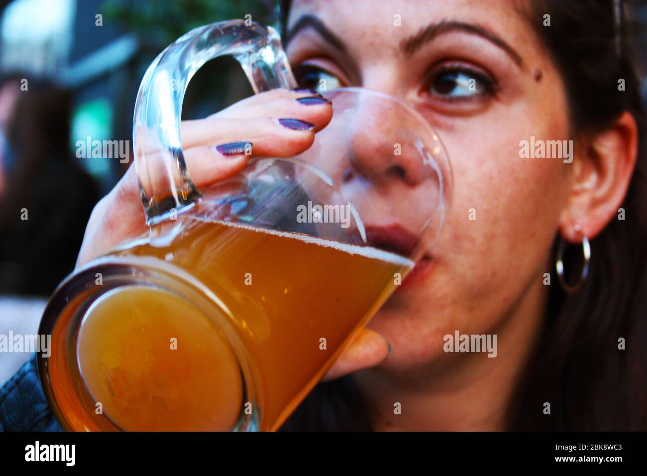 Lady drinking a pint of beer hi-res stock photography and images - Alamy
