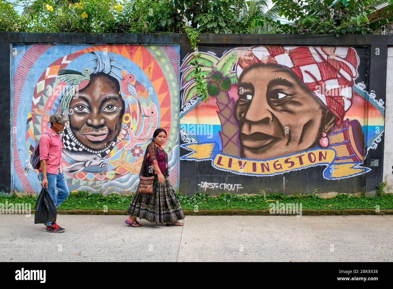 People walking in the streets of Livingston in front of a colorful ...