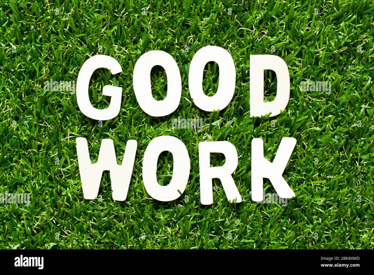 Wood alphabet letter in word good work on green grass background Stock ...