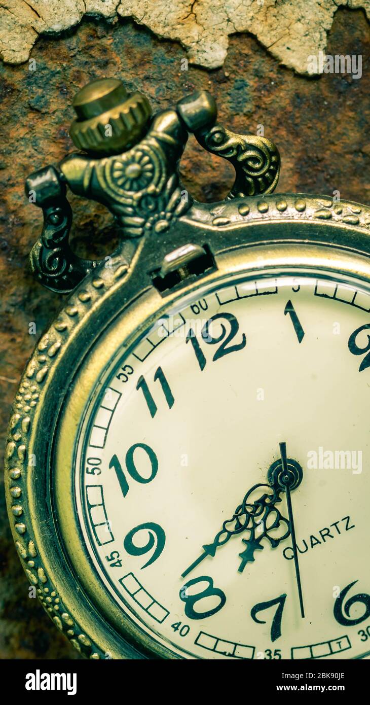 Vintage pocket watch showing time with textured background. concept of ...