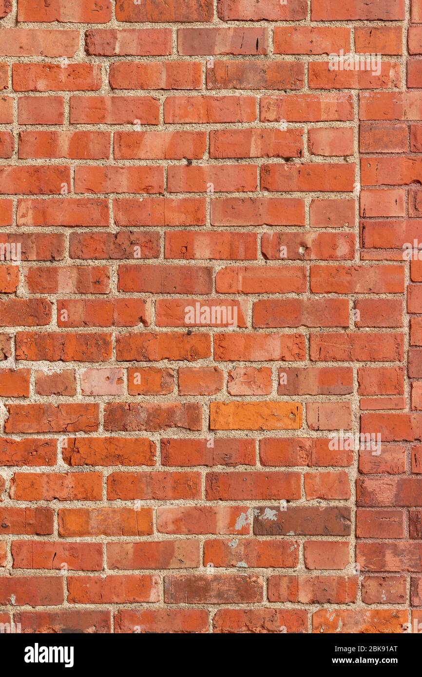 Grungy old red clay brick wall texture background, showing ...