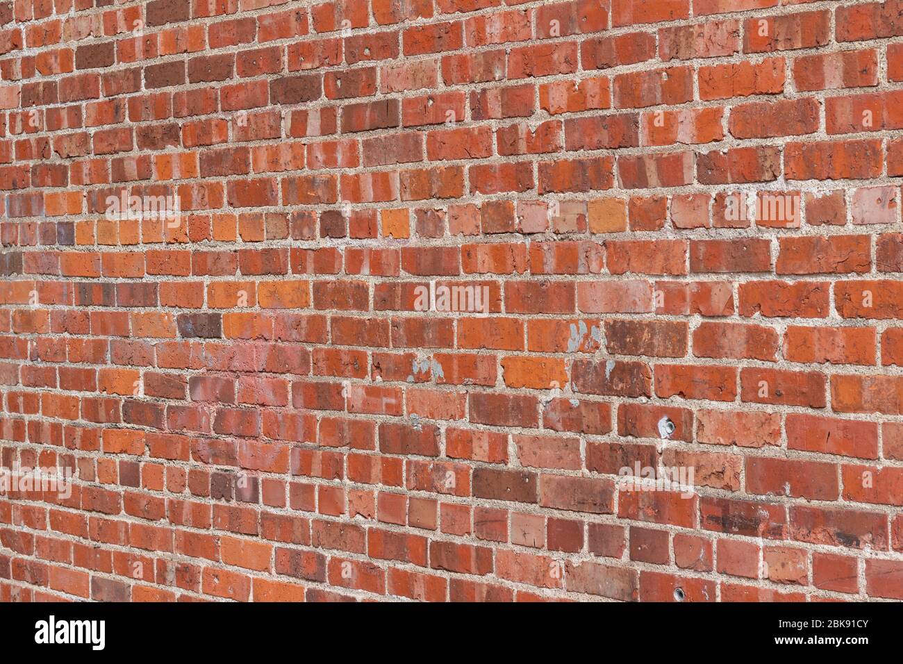 Grungy old red clay brick wall texture background, showing ...