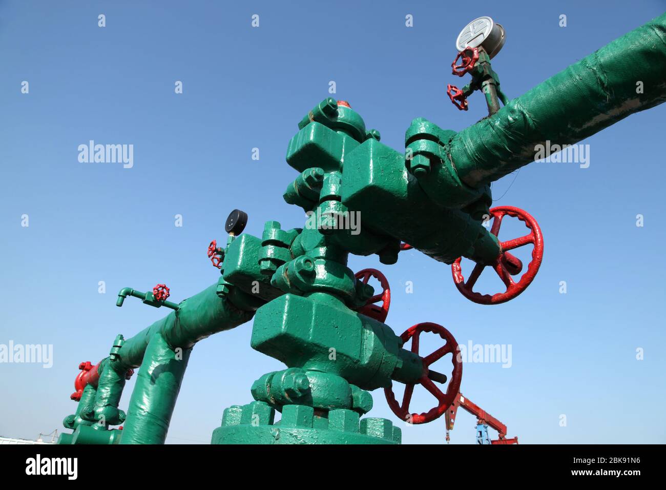 Piping and valves of oil field, close-up Stock Photo - Alamy