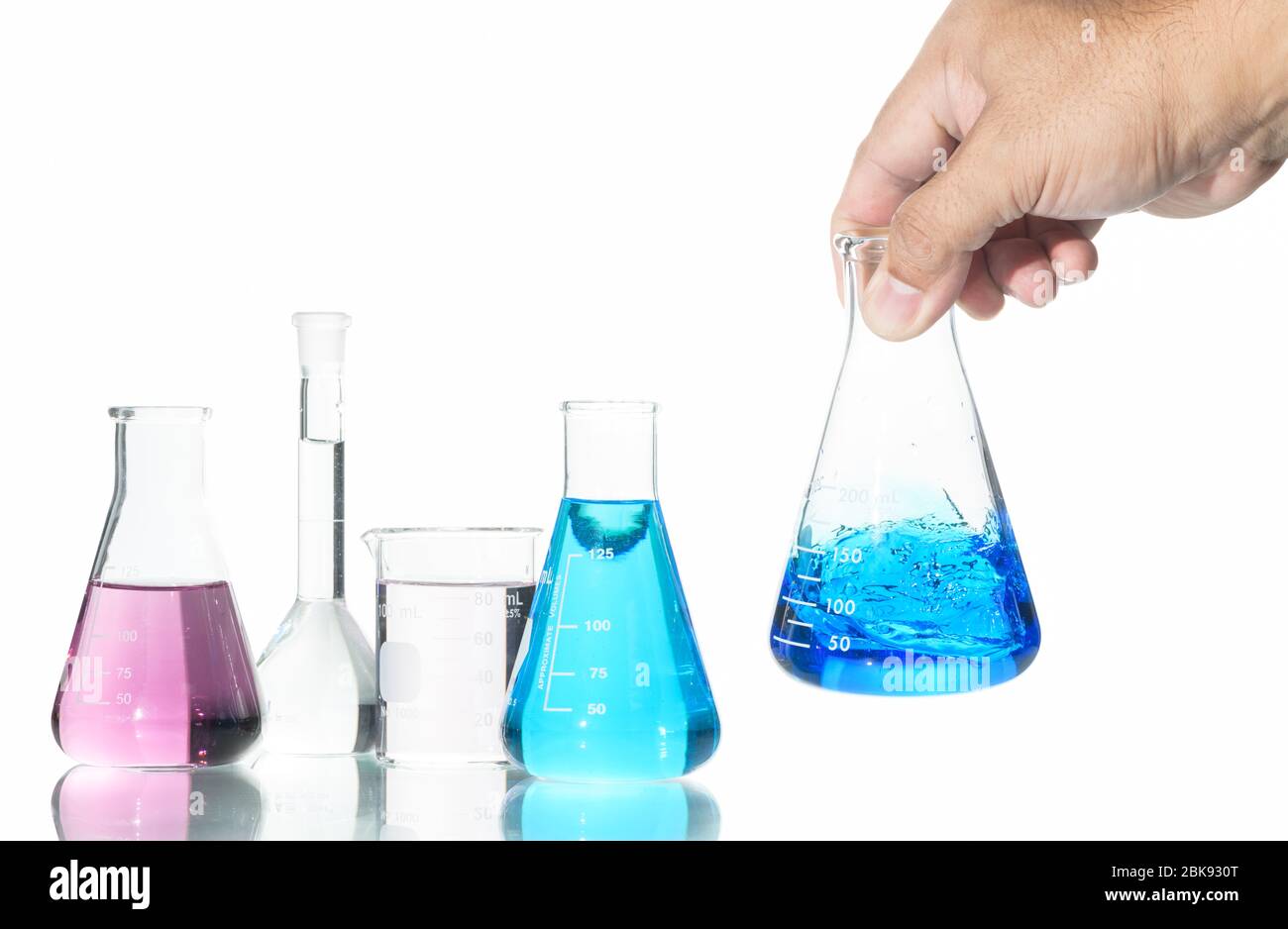 hand scientist shaking Erlenmeyer flask with blue liquid isolated on ...