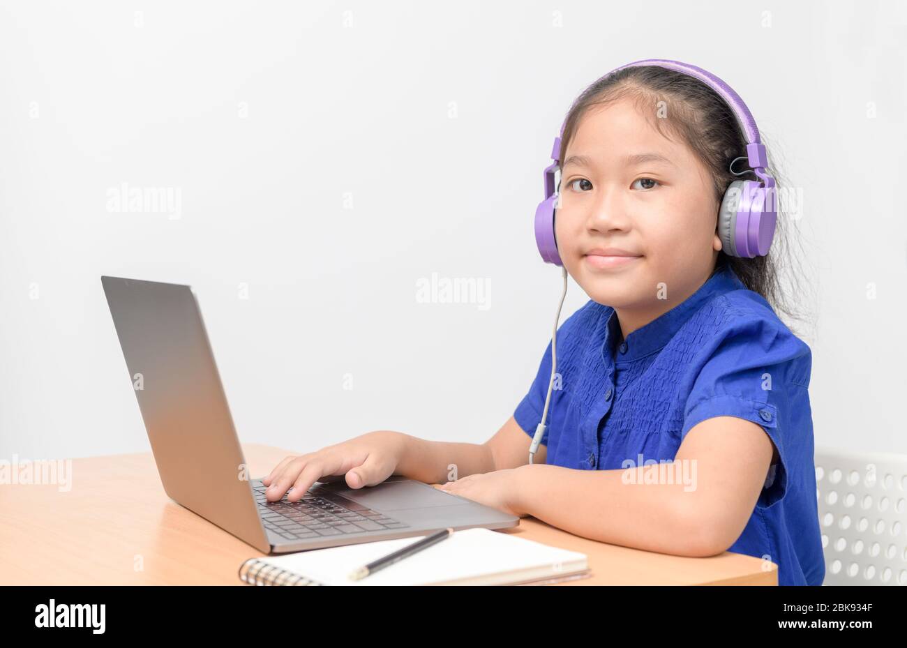Chinese school kid headphones computer hi-res stock photography and ...