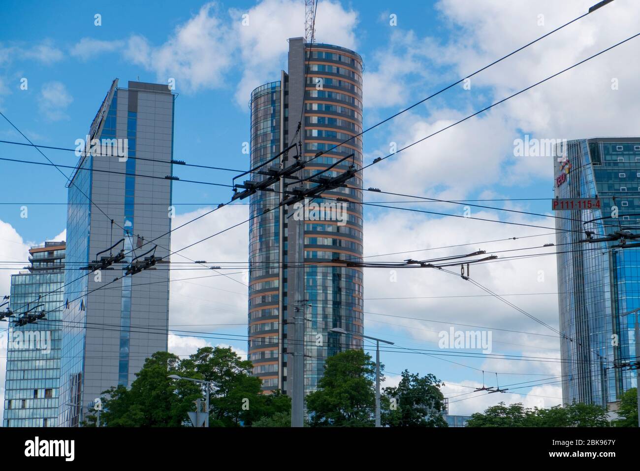 A tangle of overhead, electrified steel cable power lines for buses ...