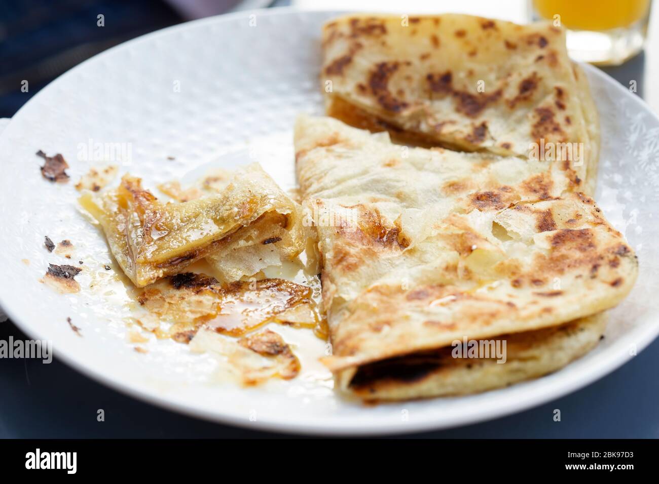 Moroccan msemen pancakes with honey Stock Photo - Alamy