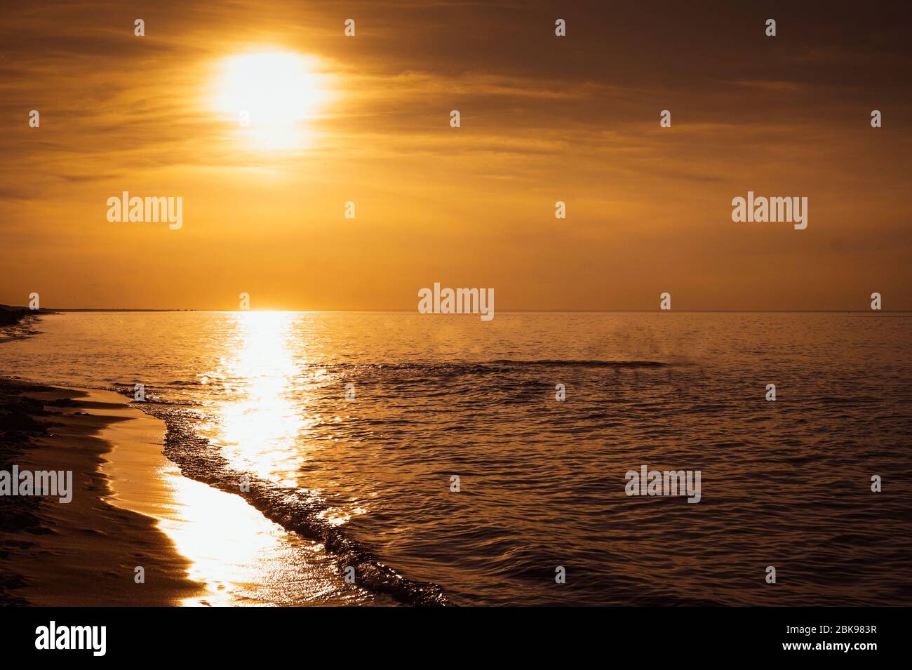 Bright sun reflecting over sea hi-res stock photography and images - Alamy
