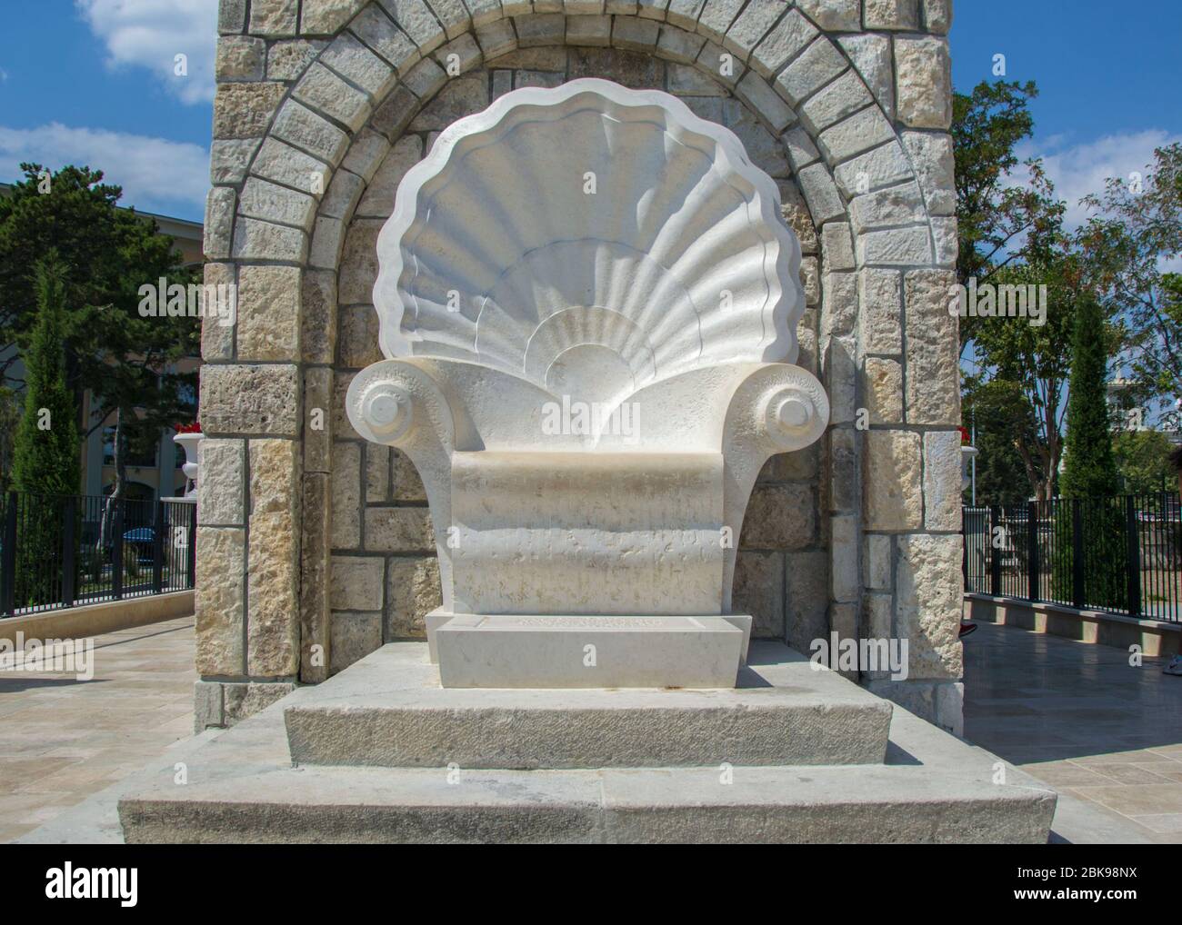 Empty cement throne in shape of a shell, seat, ancient decorative ...